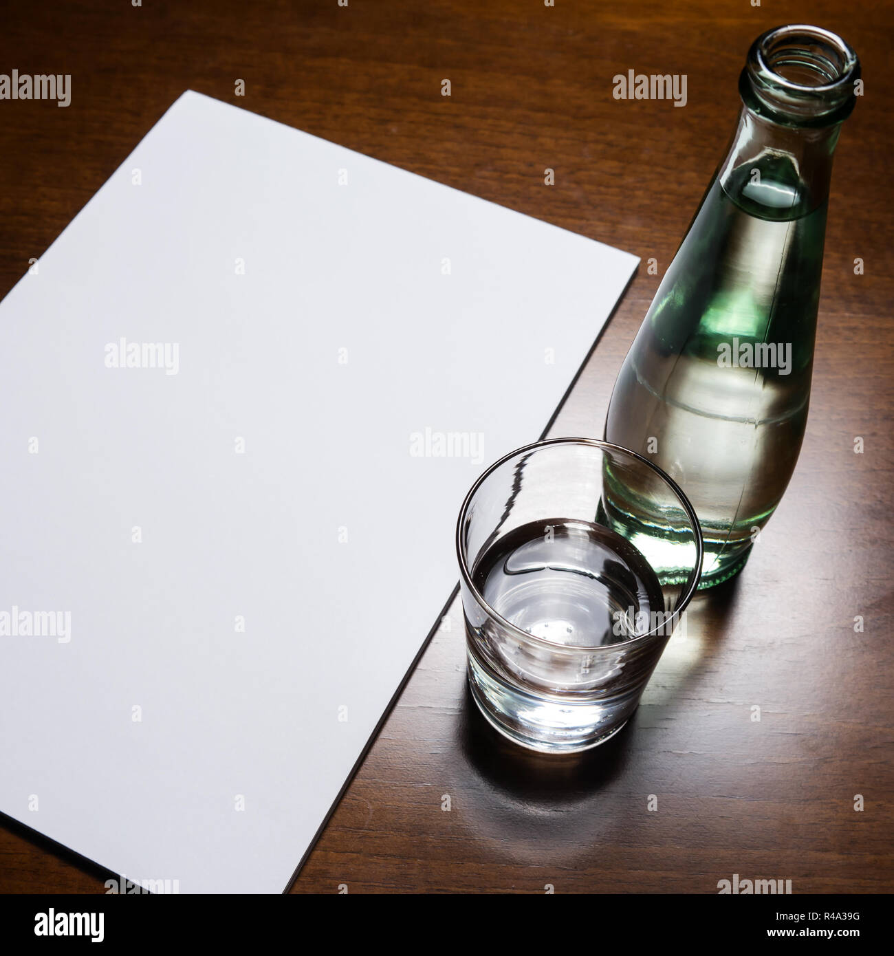 desk with note and glass of water Stock Photo - Alamy