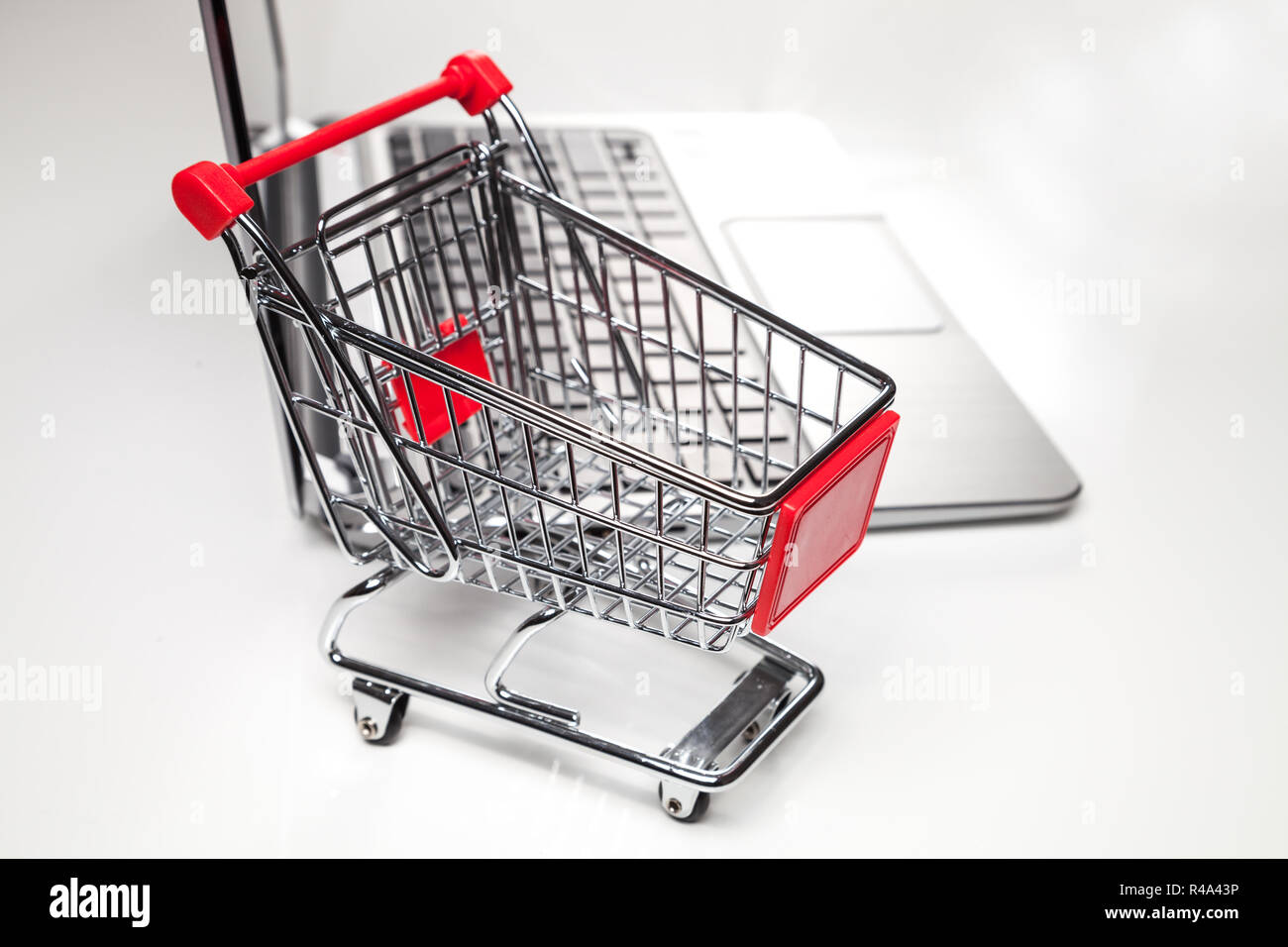 shopping cart and laptop Stock Photo - Alamy