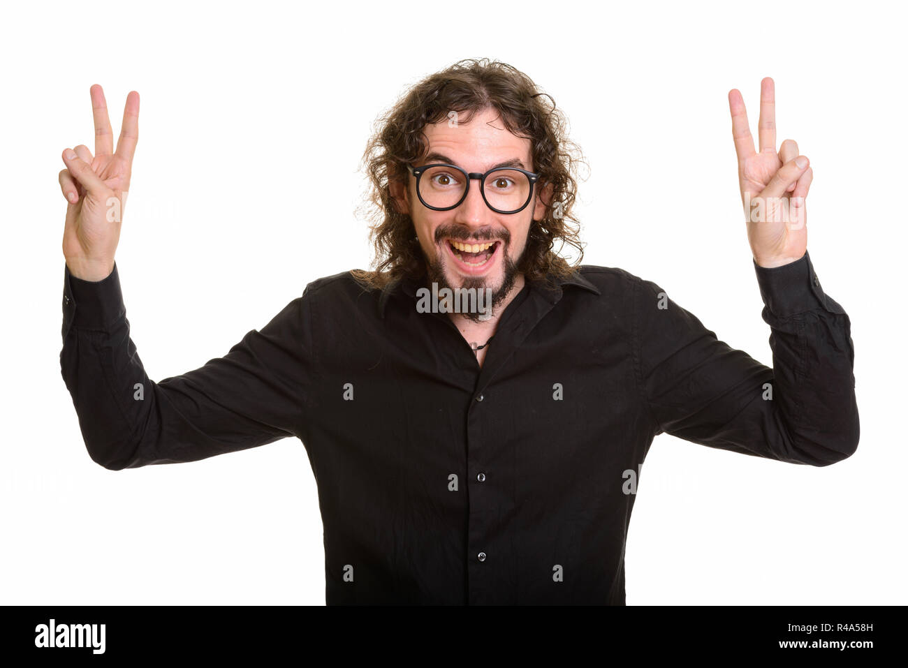 Happy handsome Caucasian man giving peace sign with both hands Stock ...