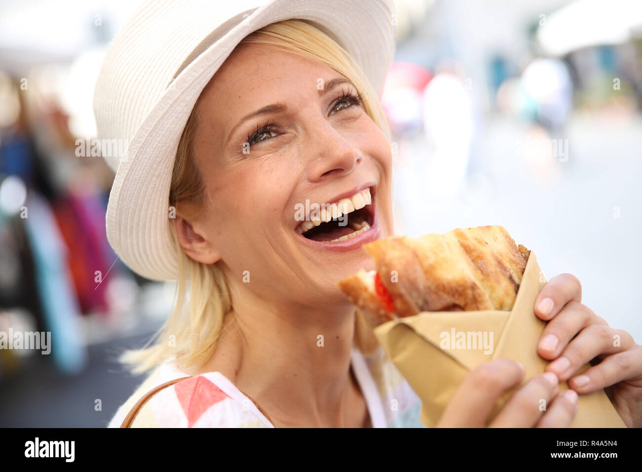 Woman tourist eating sandwich hi-res stock photography and images - Alamy