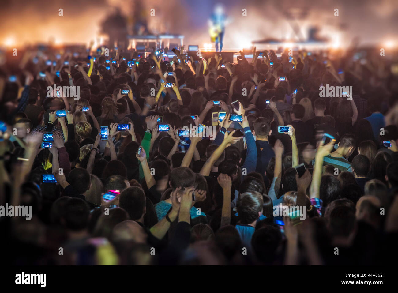 people at the concert with the phones shoot the show Stock Photo - Alamy