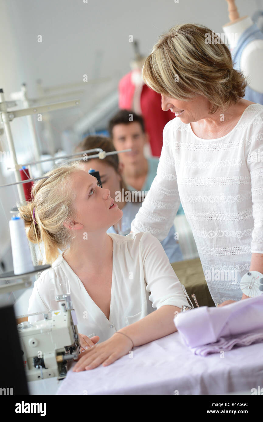 Student with teacher in dressmaking class Stock Photo - Alamy