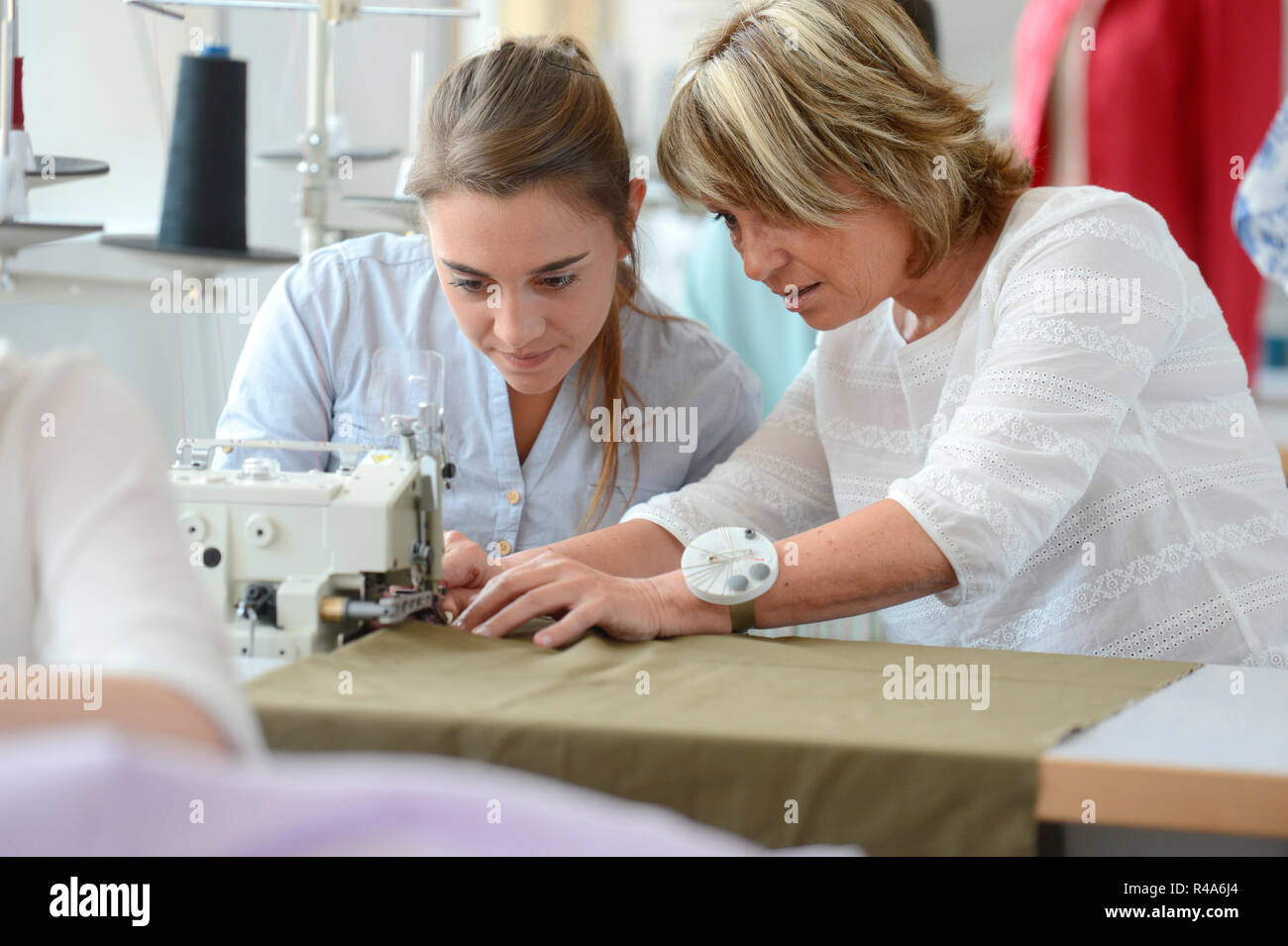 Student with teacher in dressmaking class Stock Photo - Alamy