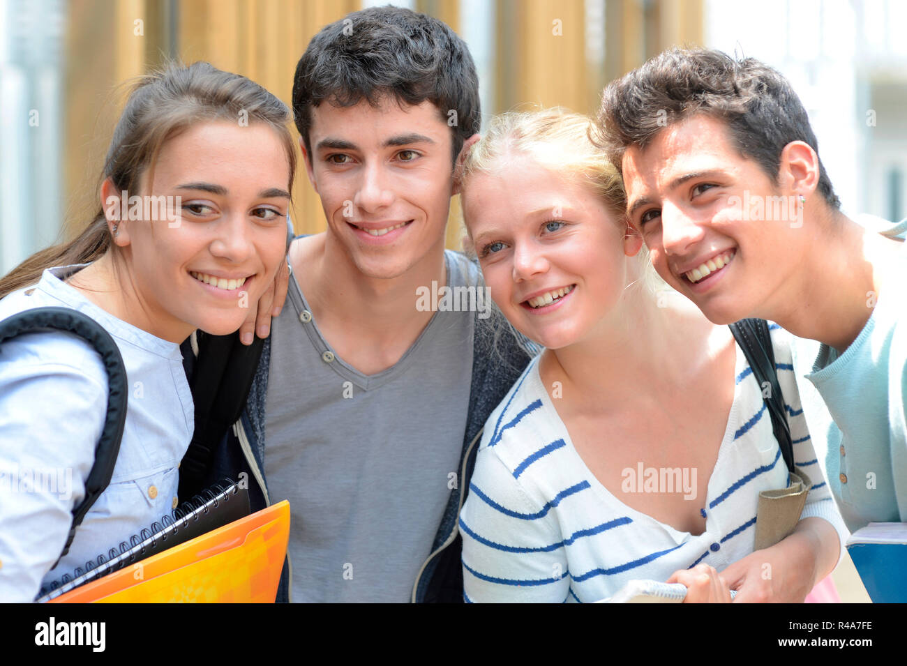 Cheerful students standing outside school building Stock Photo - Alamy