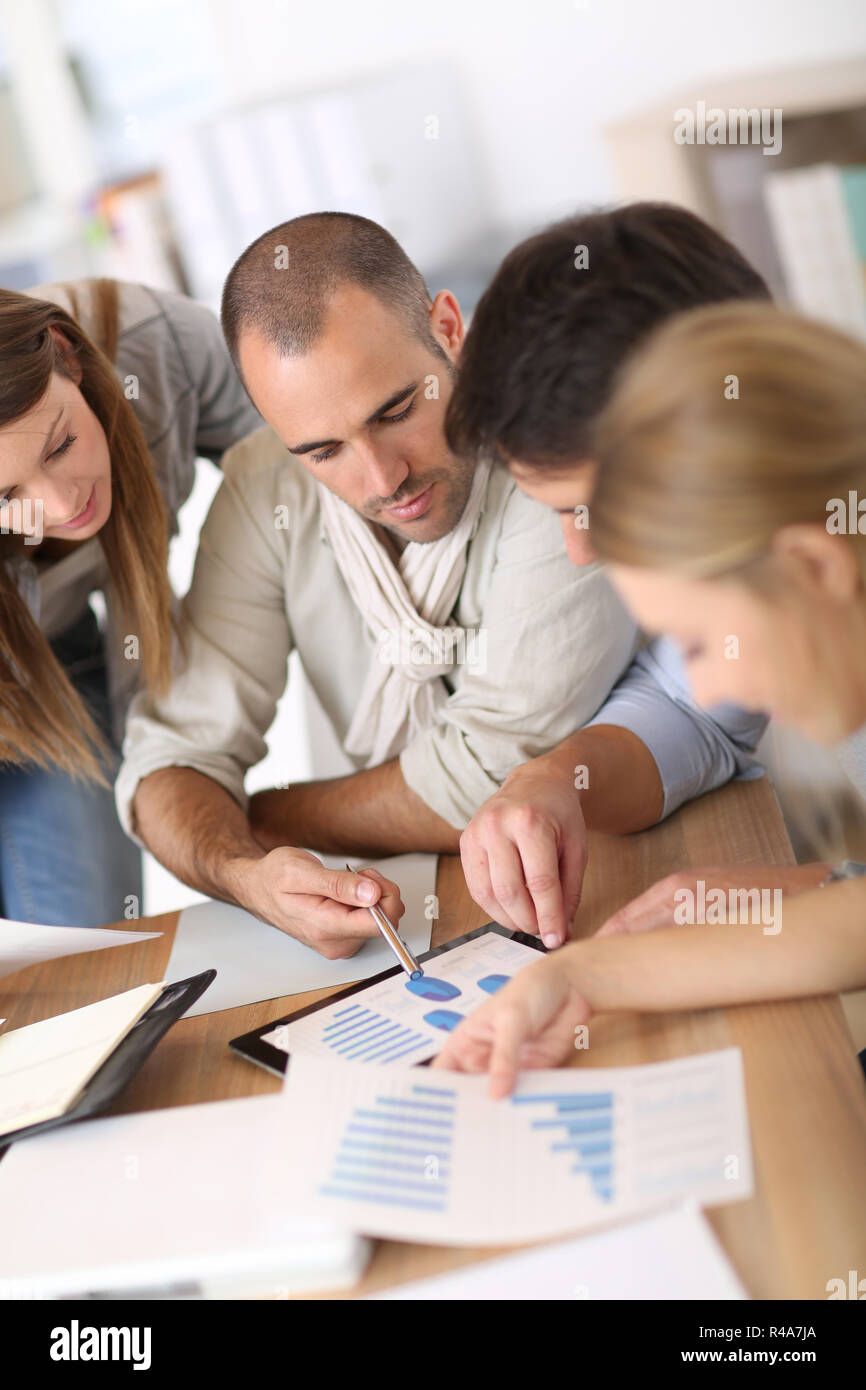 Business team working on marketing plan Stock Photo - Alamy