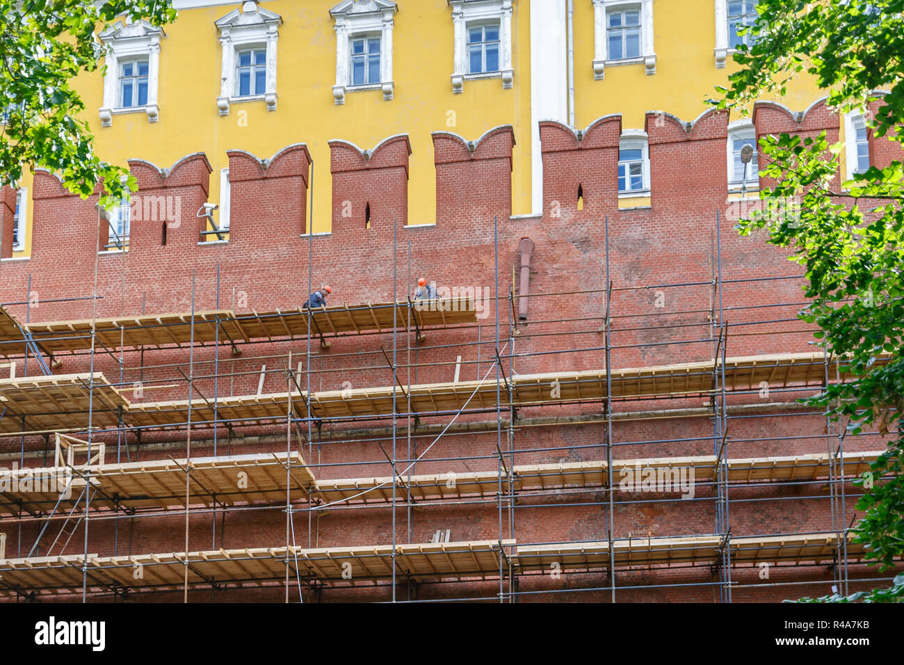 MOSCOW, RUSSIA, AUGUST 24, 2017: Workers on scaffolding are engaged in ...