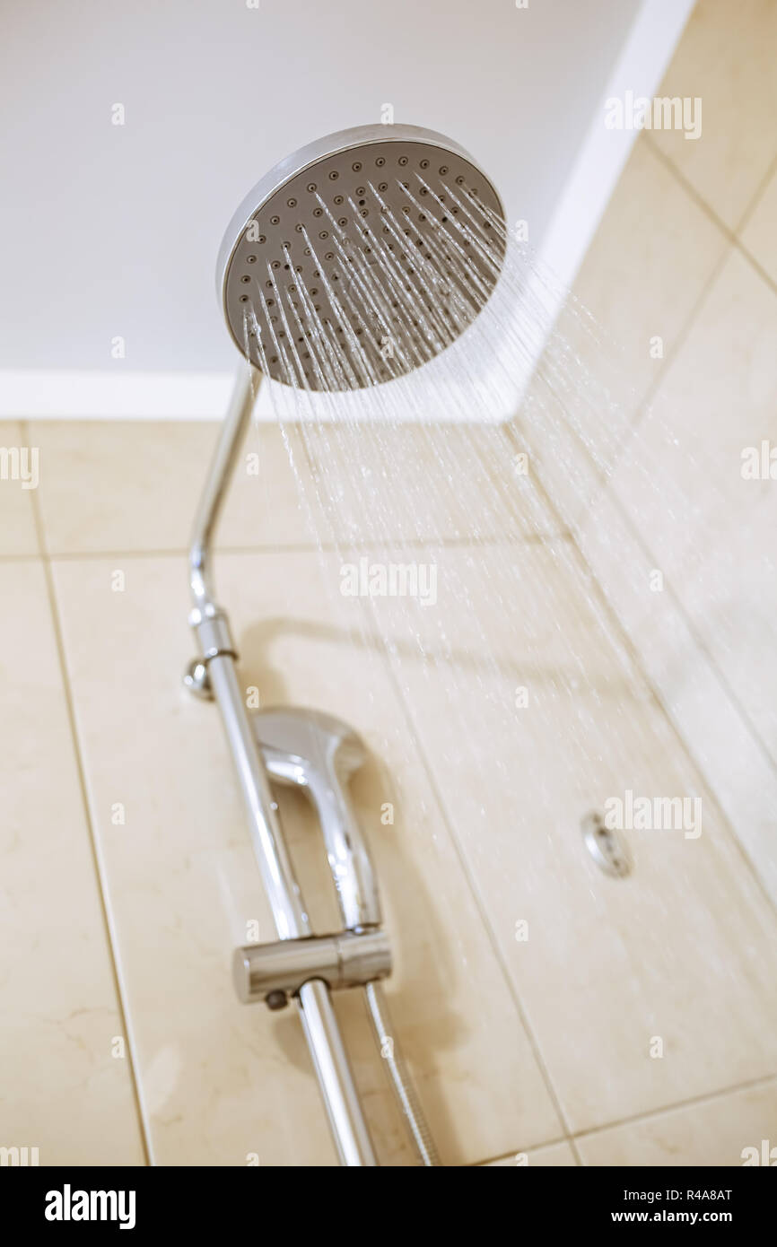 Water running from the shower head in the bathroom Stock Photo - Alamy