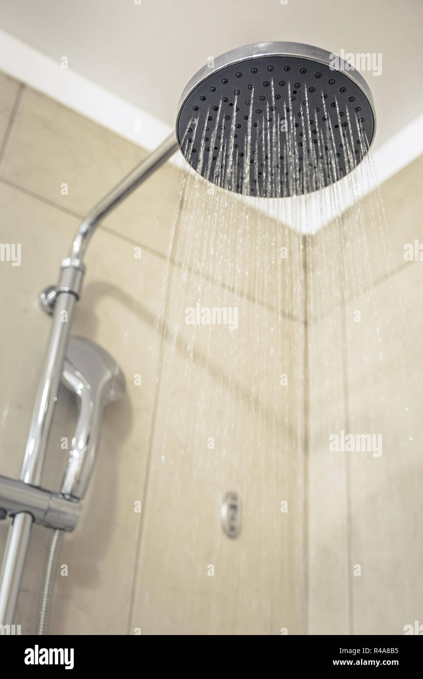 Water running from the shower head in the bathroom Stock Photo - Alamy