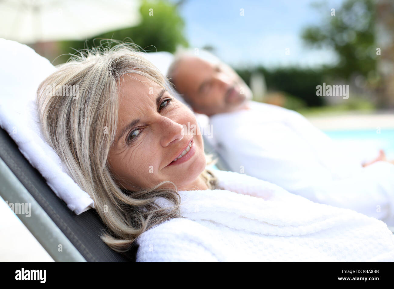 Senior woman in spa hotel relaxing by the pool Stock Photo - Alamy