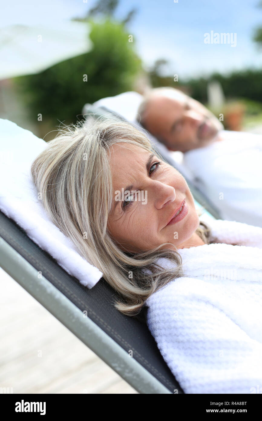 Senior woman in spa hotel relaxing by the pool Stock Photo - Alamy