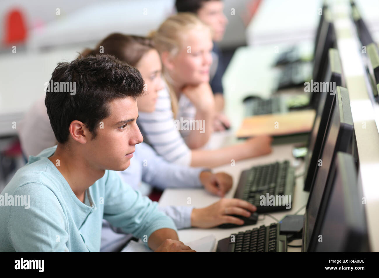 Group of students in computing class Stock Photo - Alamy