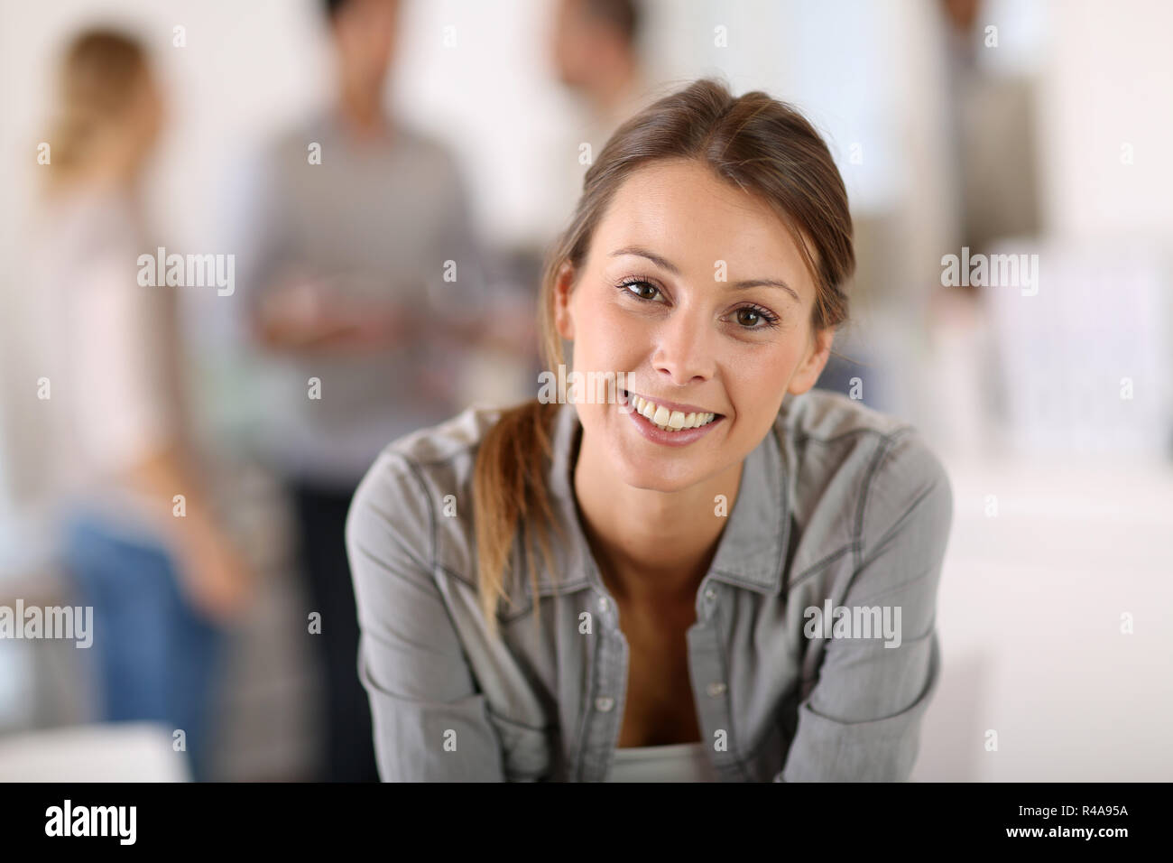 Smiling working girl Stock Photo - Alamy