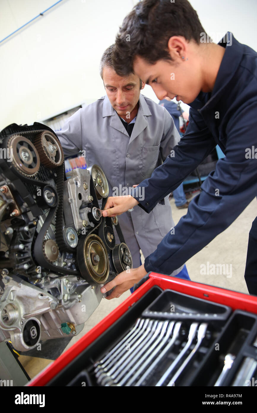 Teacher and student in auto mechanics training class Stock Photo - Alamy