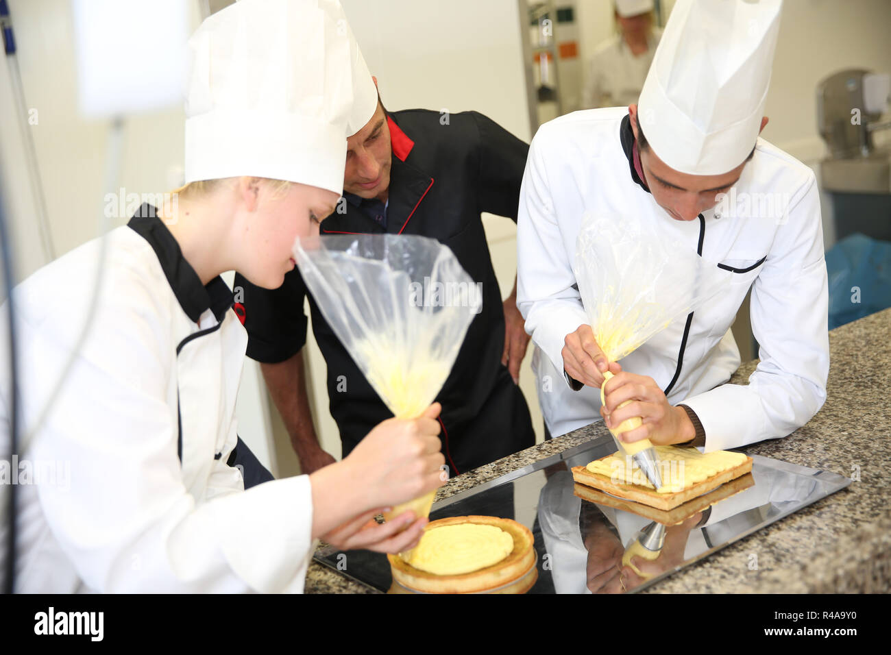 Young people in pastry training course Stock Photo - Alamy