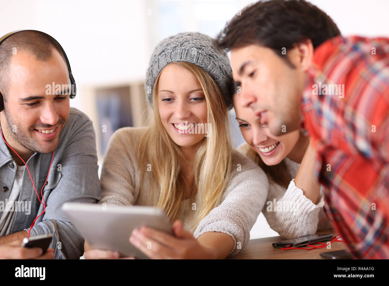 Group of teens using digital technologies Stock Photo - Alamy