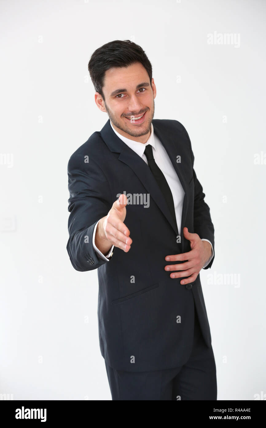 Closeup of businessman giving handshake Stock Photo - Alamy