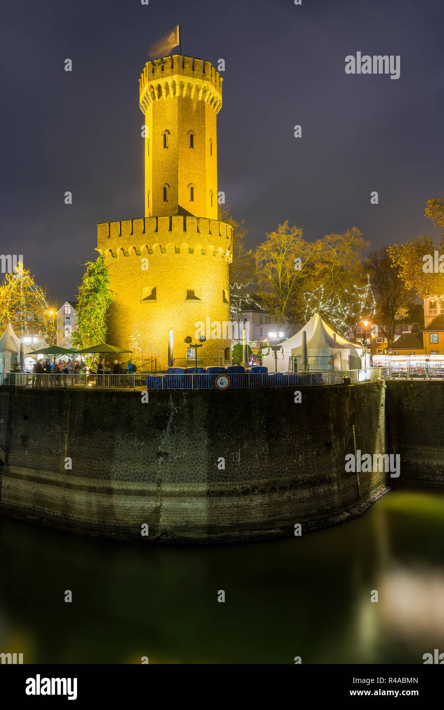 View of the illuminated Malakoff Tower at Night on the Rhine in Germany ...