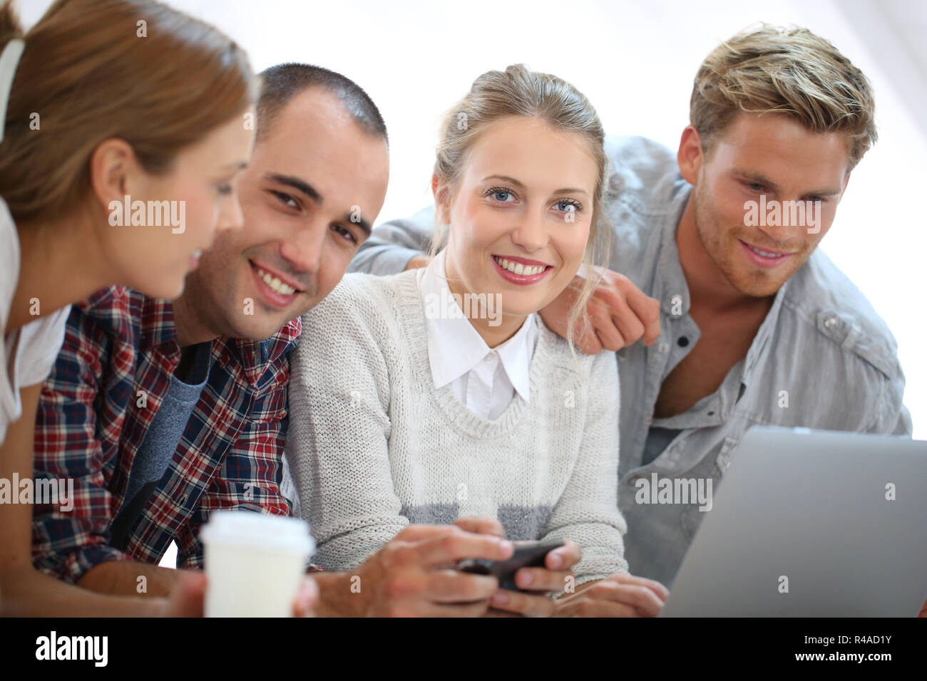 Group of students using laptop computer Stock Photo - Alamy