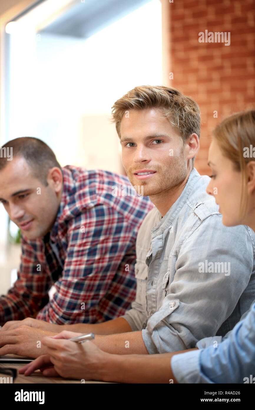 Portrait of smiling student gathering with friends Stock Photo - Alamy