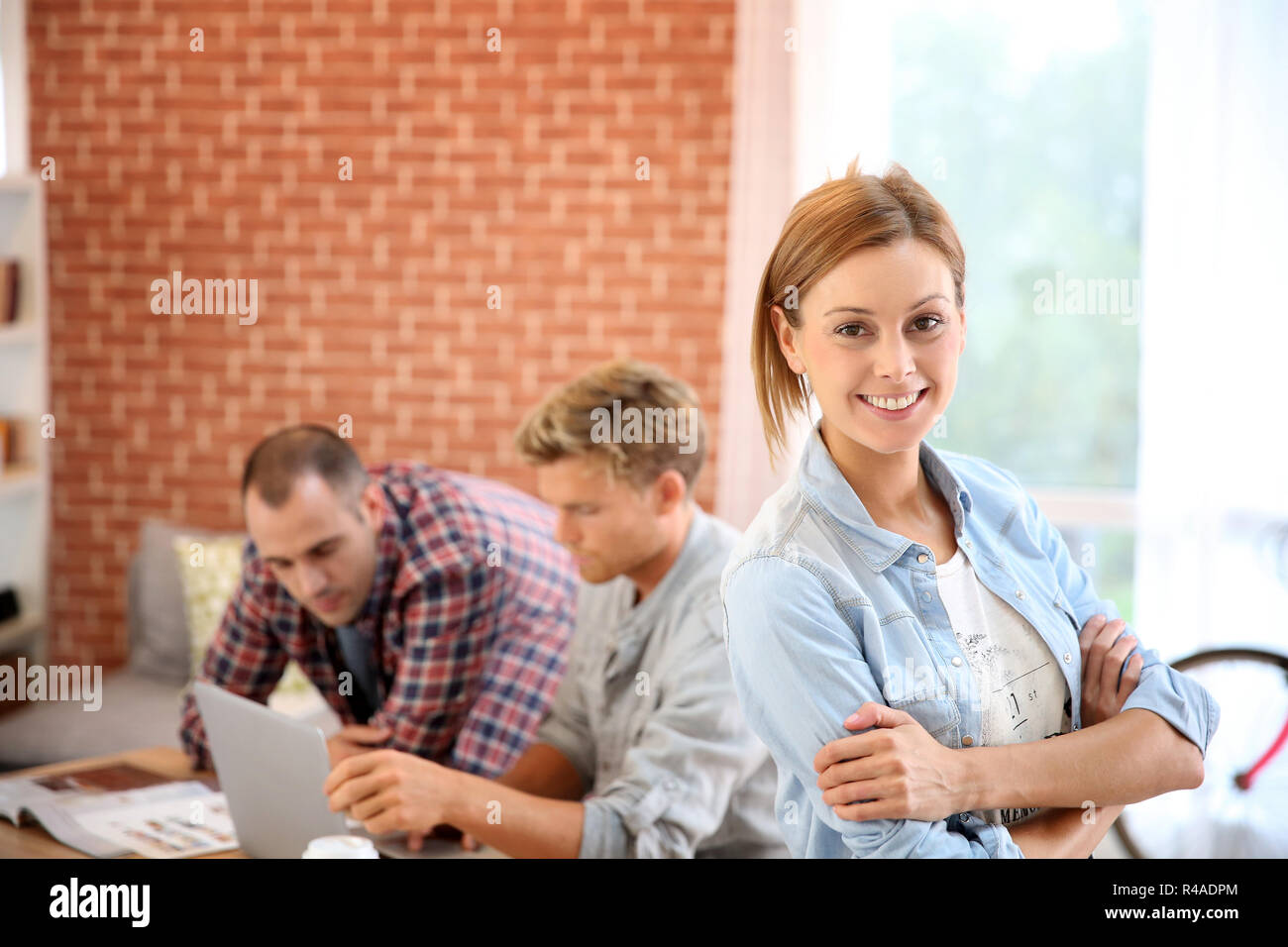 Portrait of student girl at home with roommates Stock Photo - Alamy