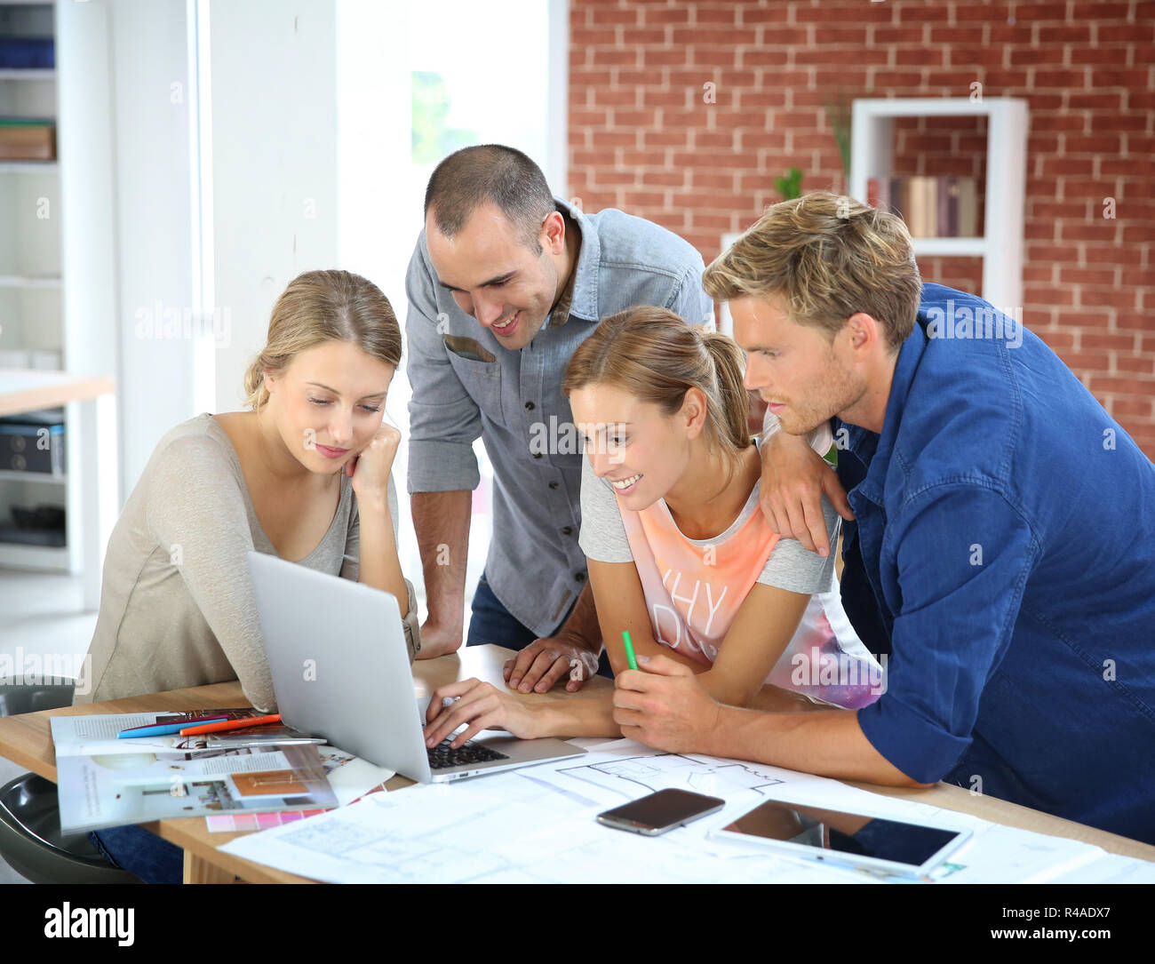 Group of students working on construction project Stock Photo - Alamy