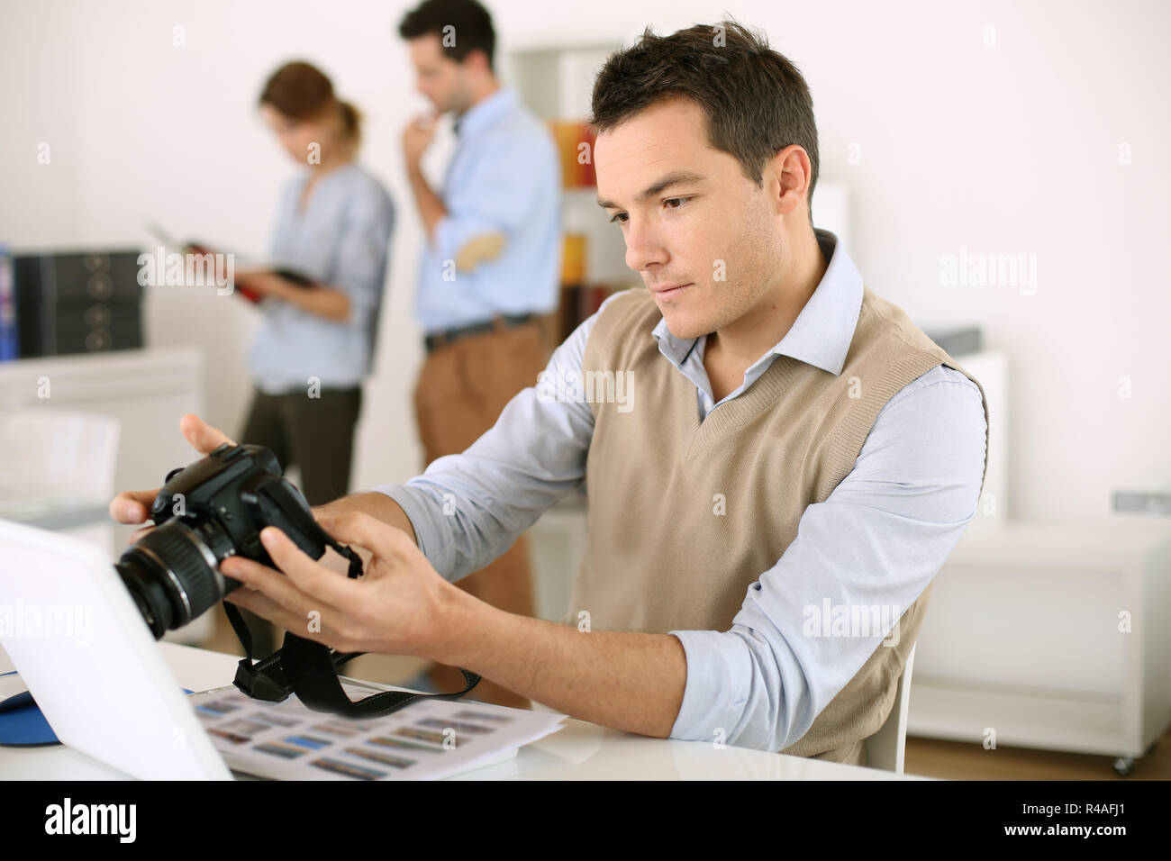 Journalist working in office Stock Photo - Alamy