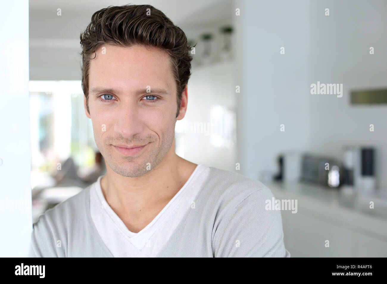 Portrait of handsome single man at home Stock Photo - Alamy