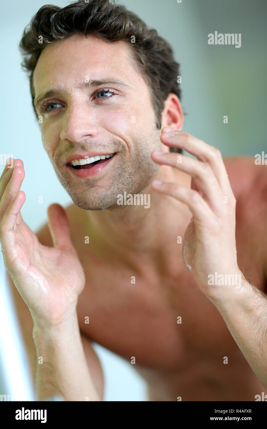 Closeup of handsome guy cleansing his face Stock Photo - Alamy