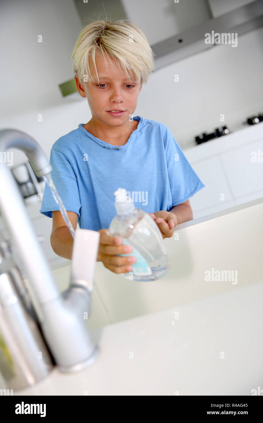 Young boy washing his hands Stock Photo - Alamy