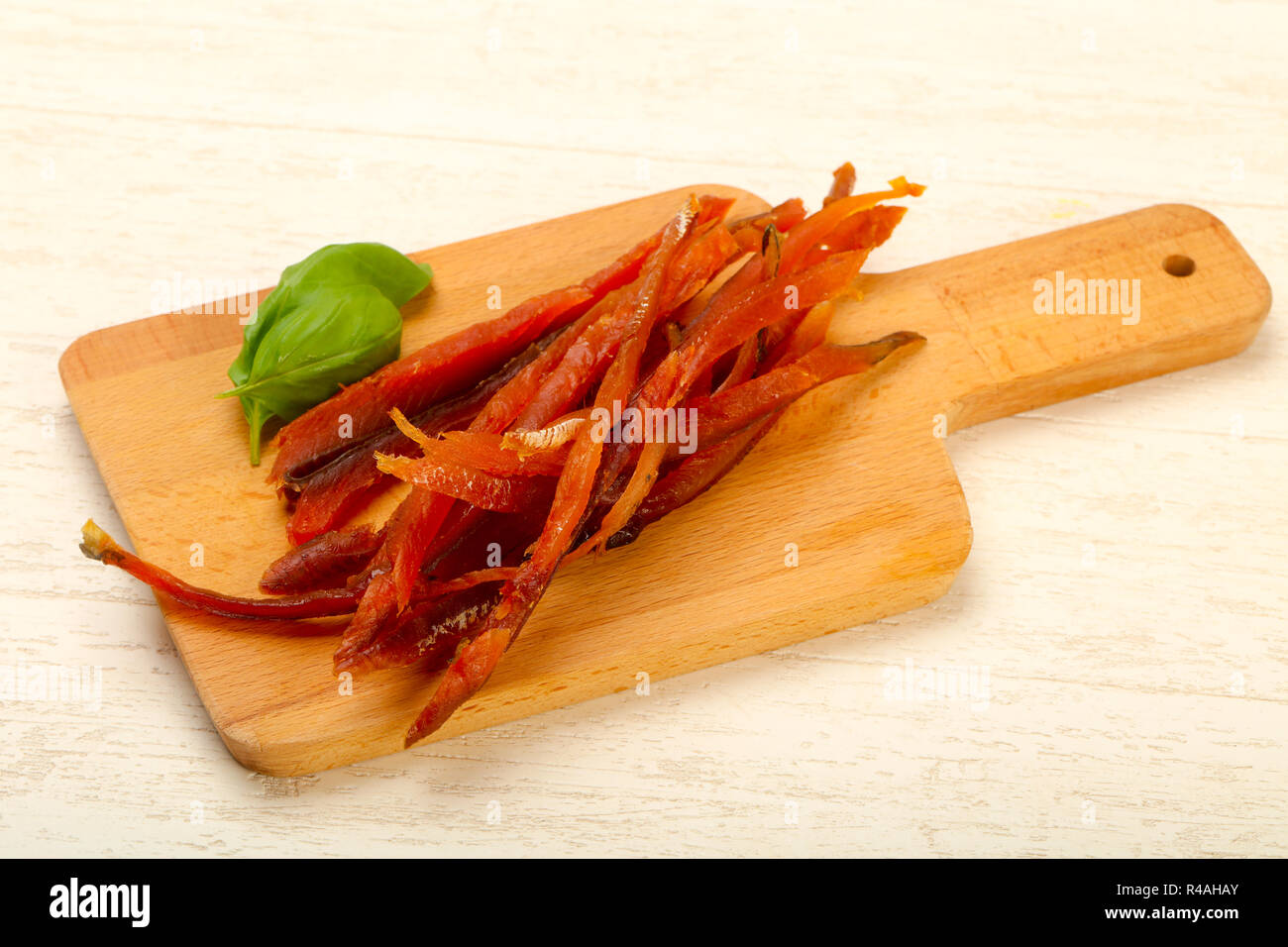 Salmon dry sticks snack Stock Photo - Alamy