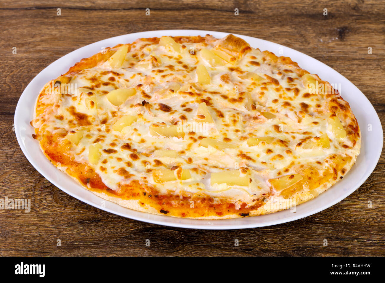 Pineapple pizza with soft cheese Stock Photo - Alamy