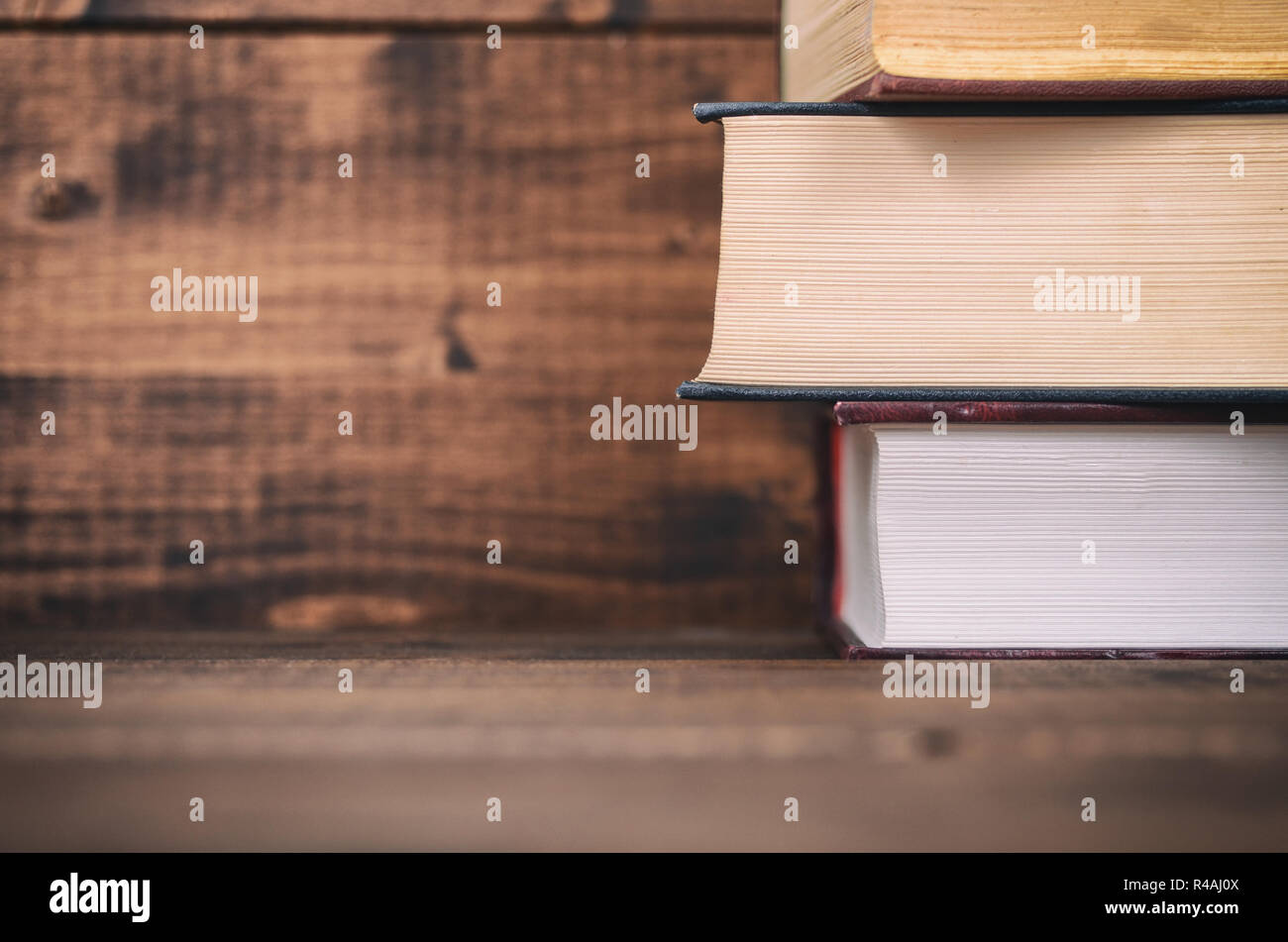 Old Law books on the brown wooden background, brown wooden backdrop ...