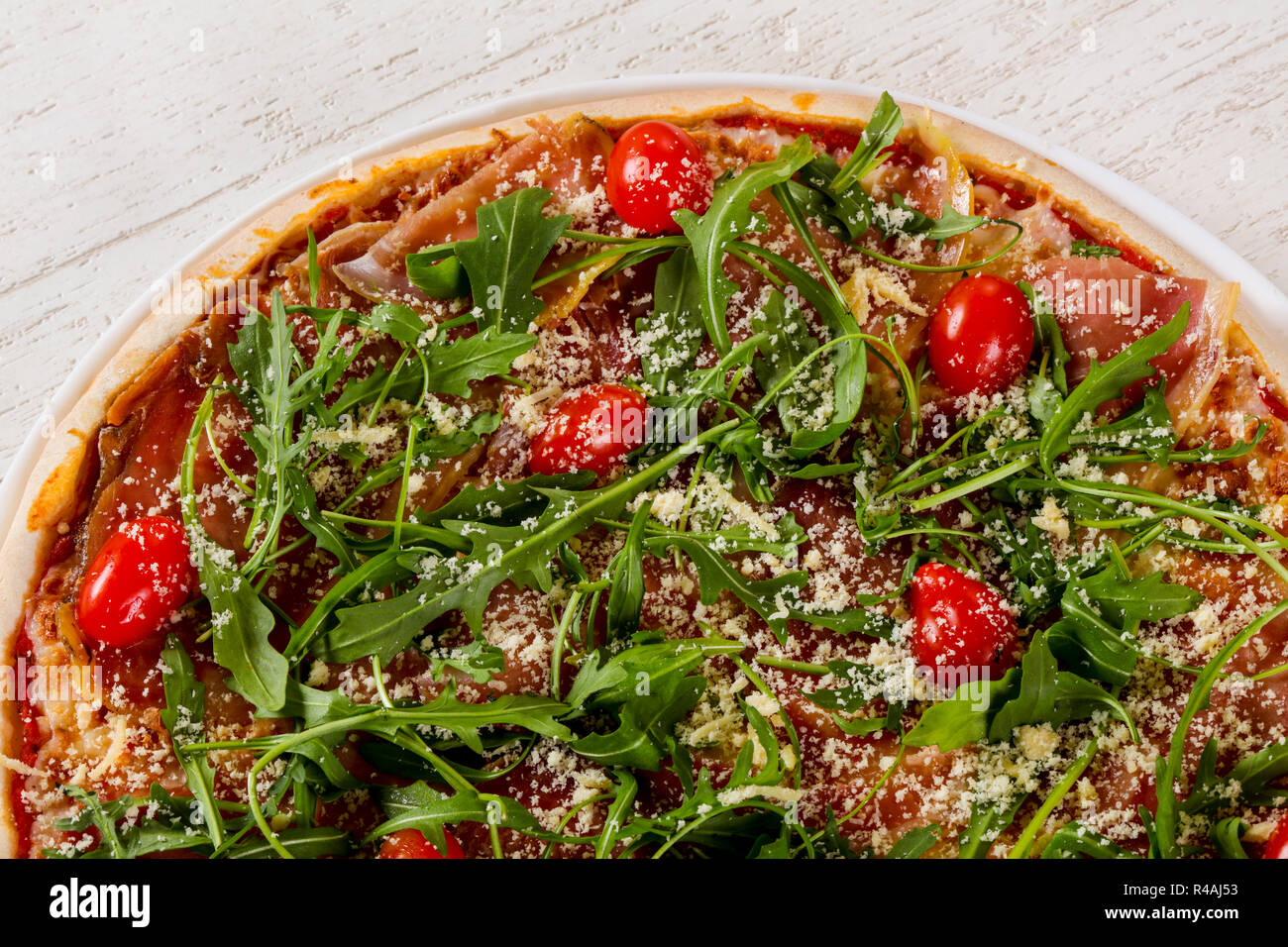 Pizza with hamon and ruccola Stock Photo - Alamy