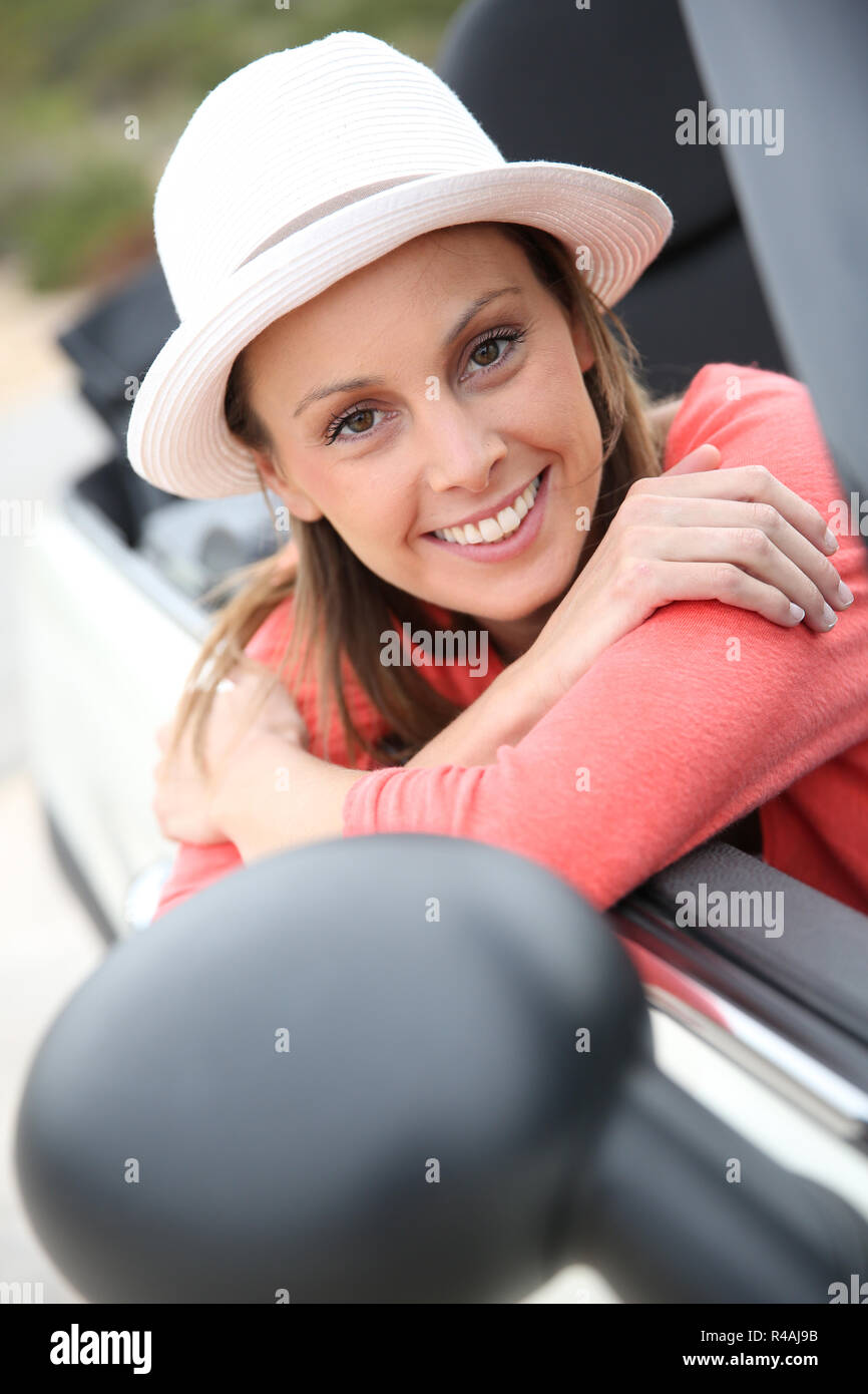 Portrait of smiling girl in convertible car Stock Photo - Alamy