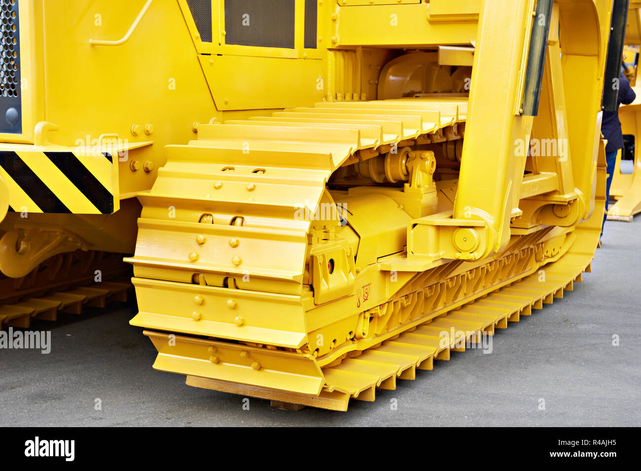 Yellow bulldozer in modern exhibition Stock Photo - Alamy