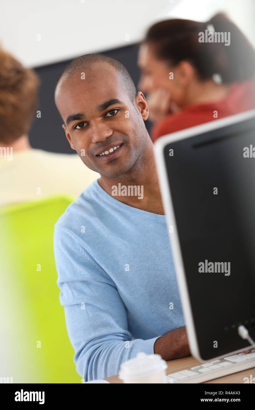 Man working on desktop computer Stock Photo - Alamy