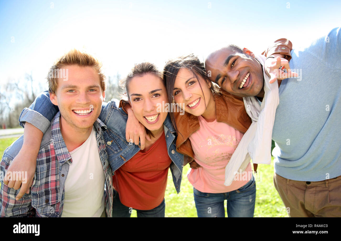 Group of students having fun outside college campus Stock Photo - Alamy