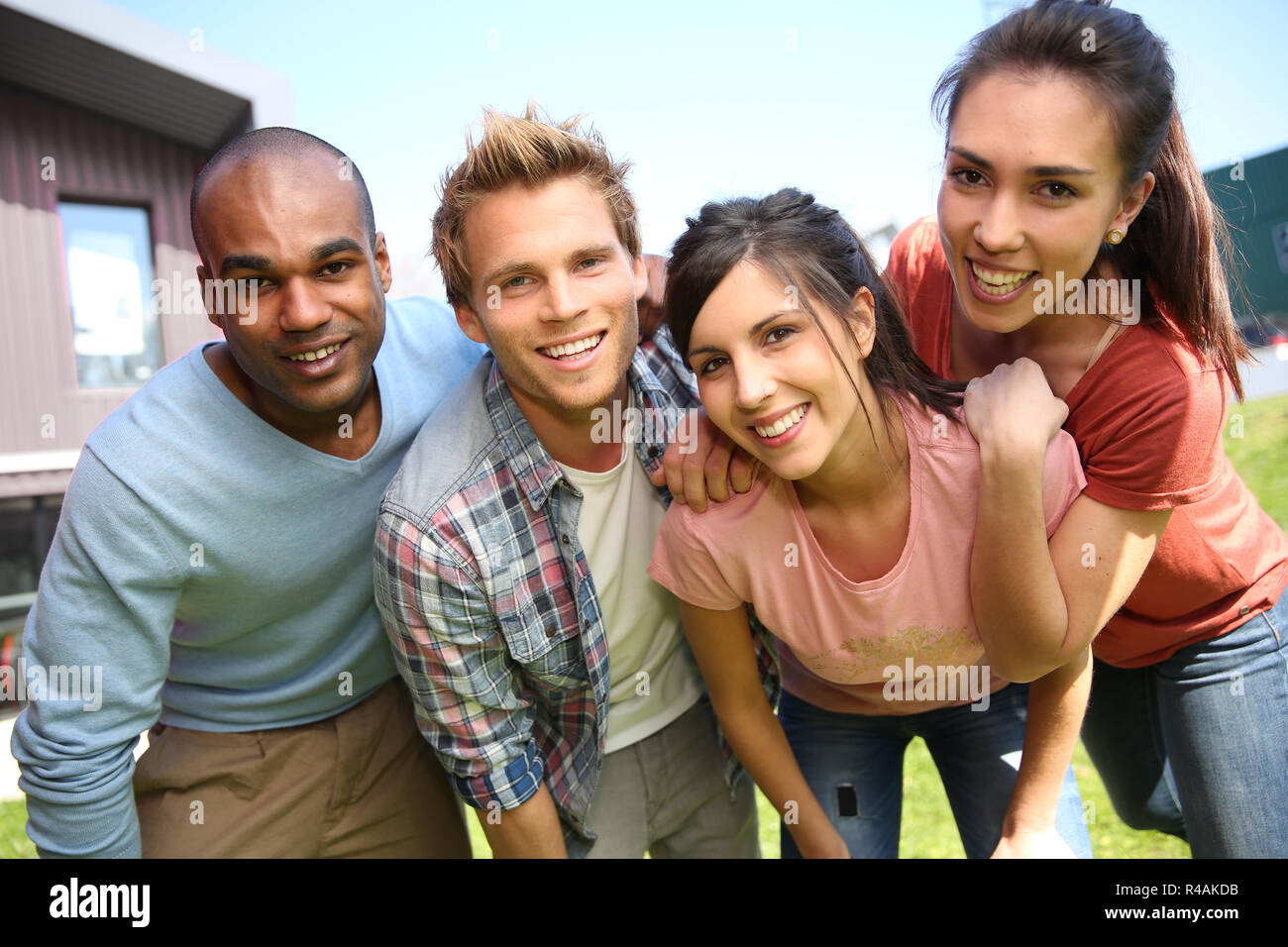 Group of students having fun outside college campus Stock Photo - Alamy
