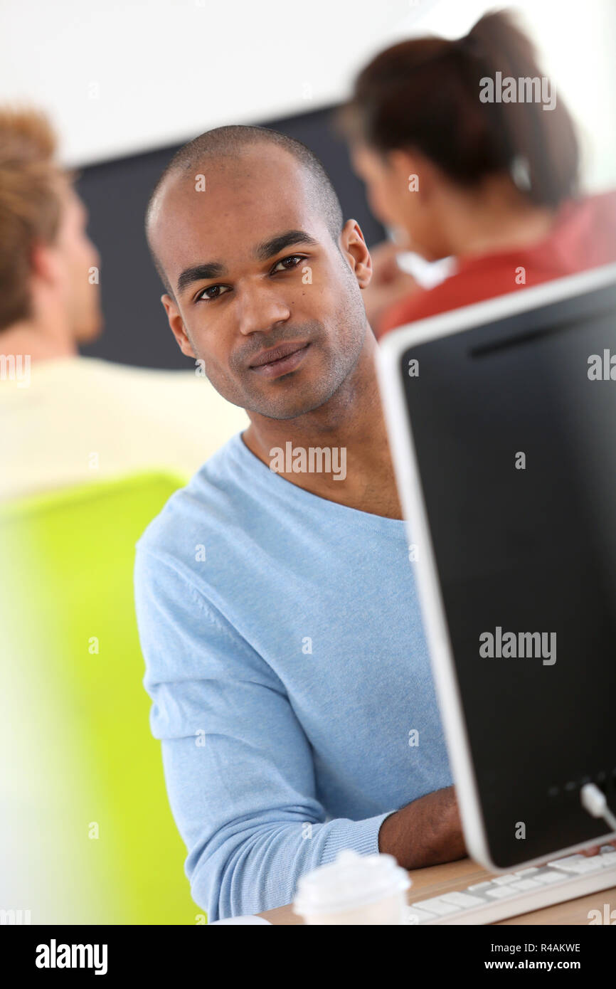 Man working on desktop computer Stock Photo - Alamy