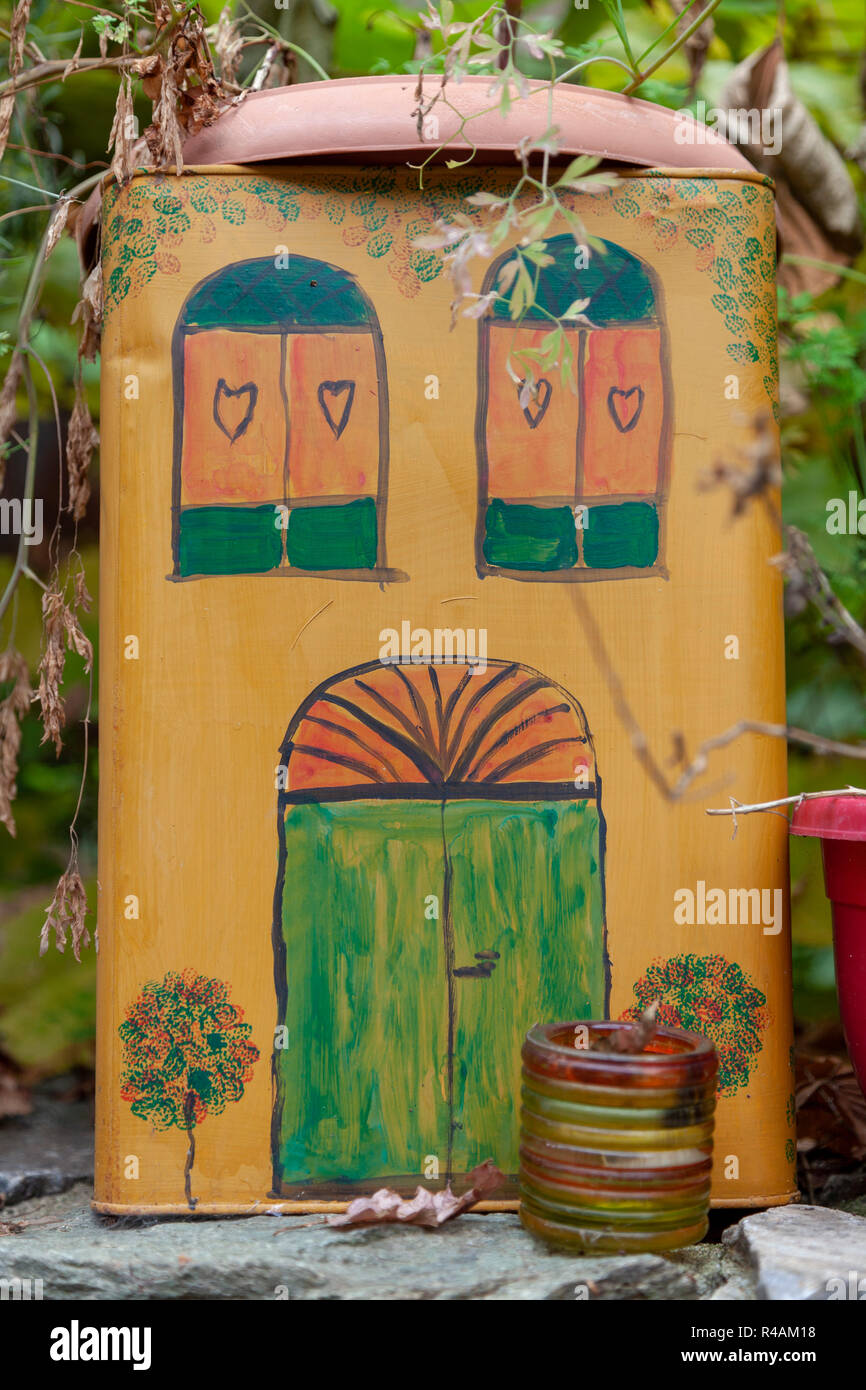 Painted tin as a yellow traditional Greek house Stock Photo - Alamy