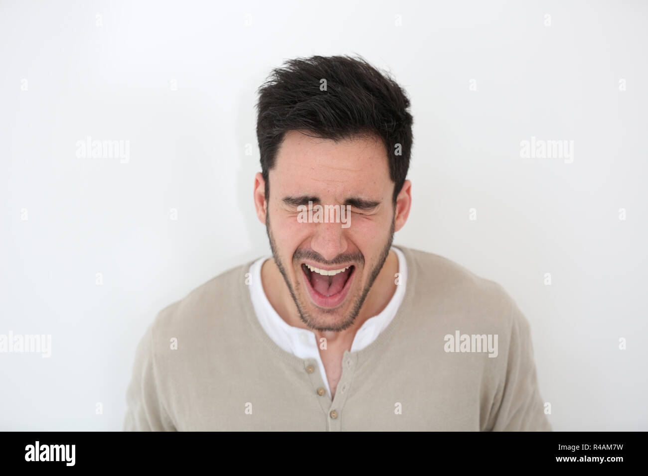 Portrait of man shouting outloud Stock Photo - Alamy