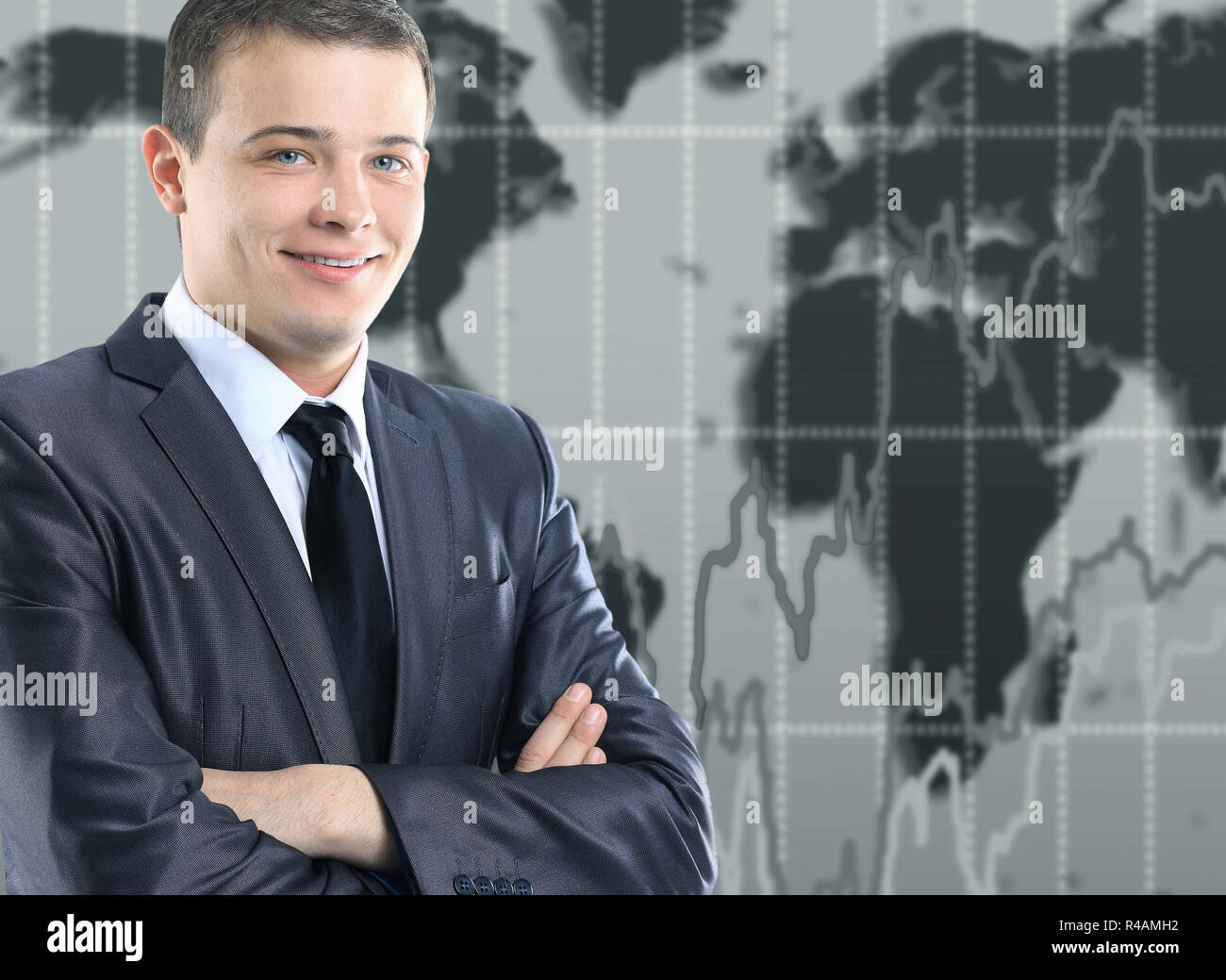 Young, beautiful, successful businessman on the world map background ...