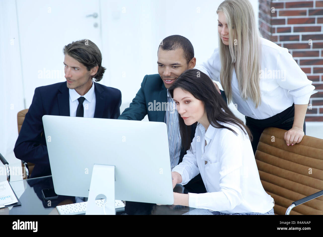 business people discussing financial information,sitting at his Desk ...