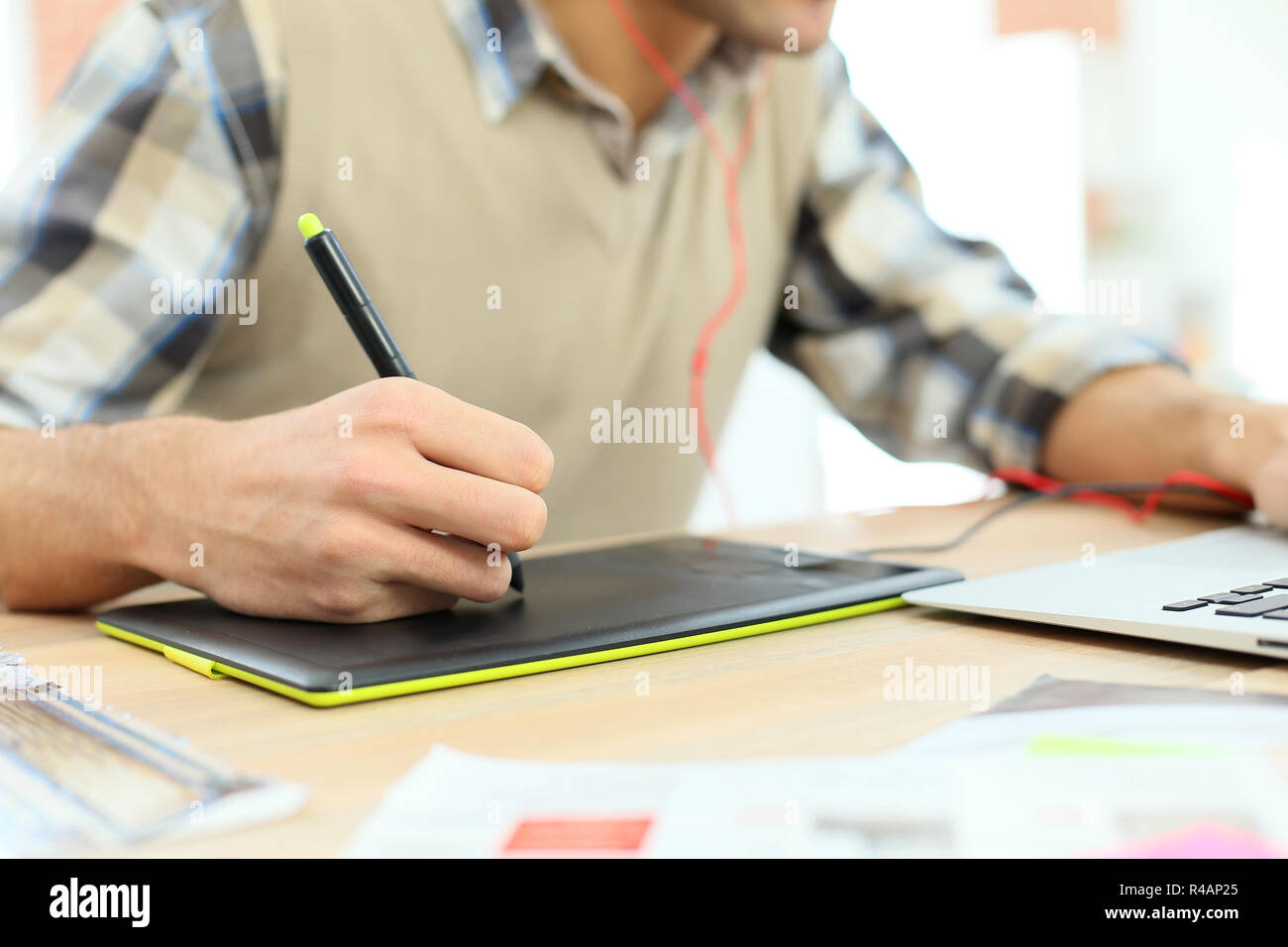 Closeup on designer using graphic tablet for photo editing Stock Photo ...