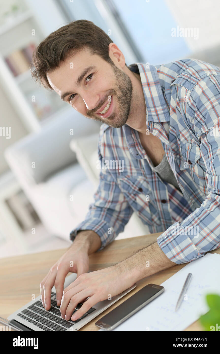 Portrait of smiling home-office worker Stock Photo - Alamy
