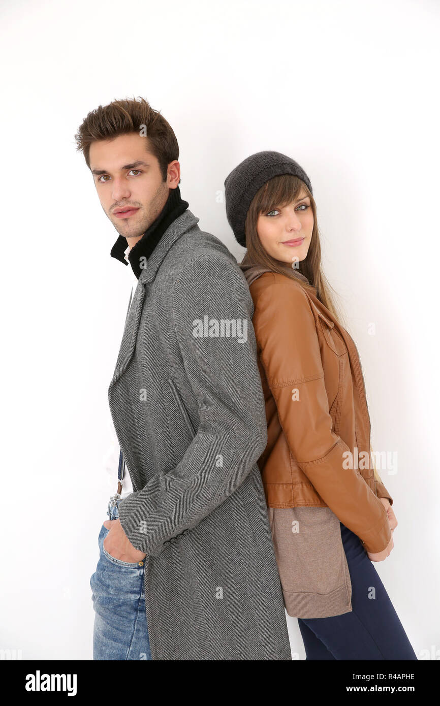 Trendy couple of lovers standing on white background Stock Photo - Alamy