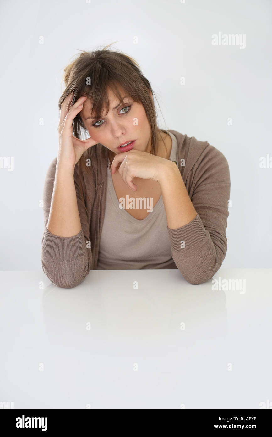 Portrait of young woman being tired, isolated Stock Photo - Alamy