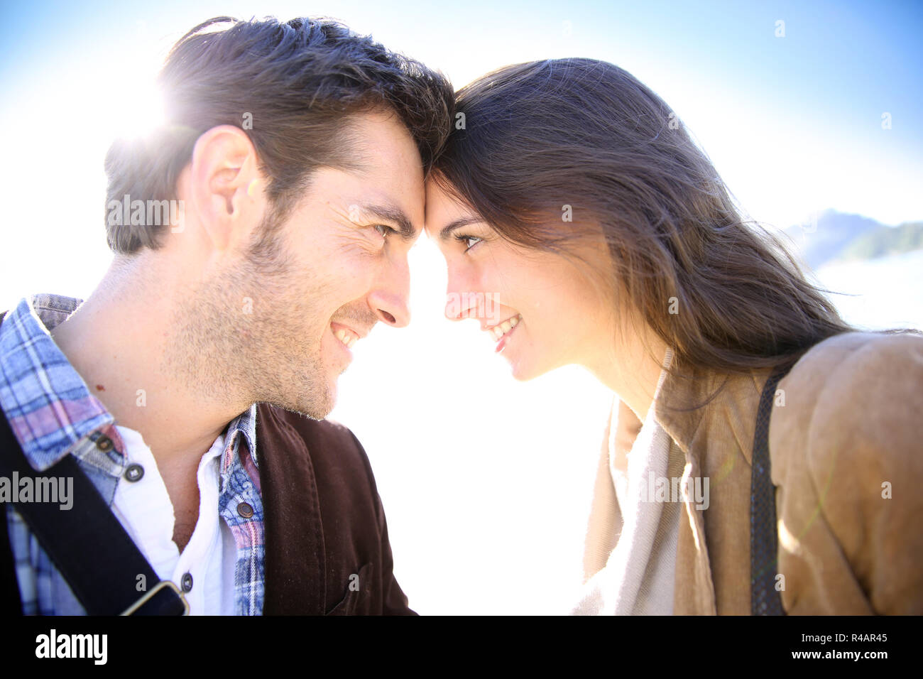 Sweet couple looking at each other's eyes Stock Photo - Alamy