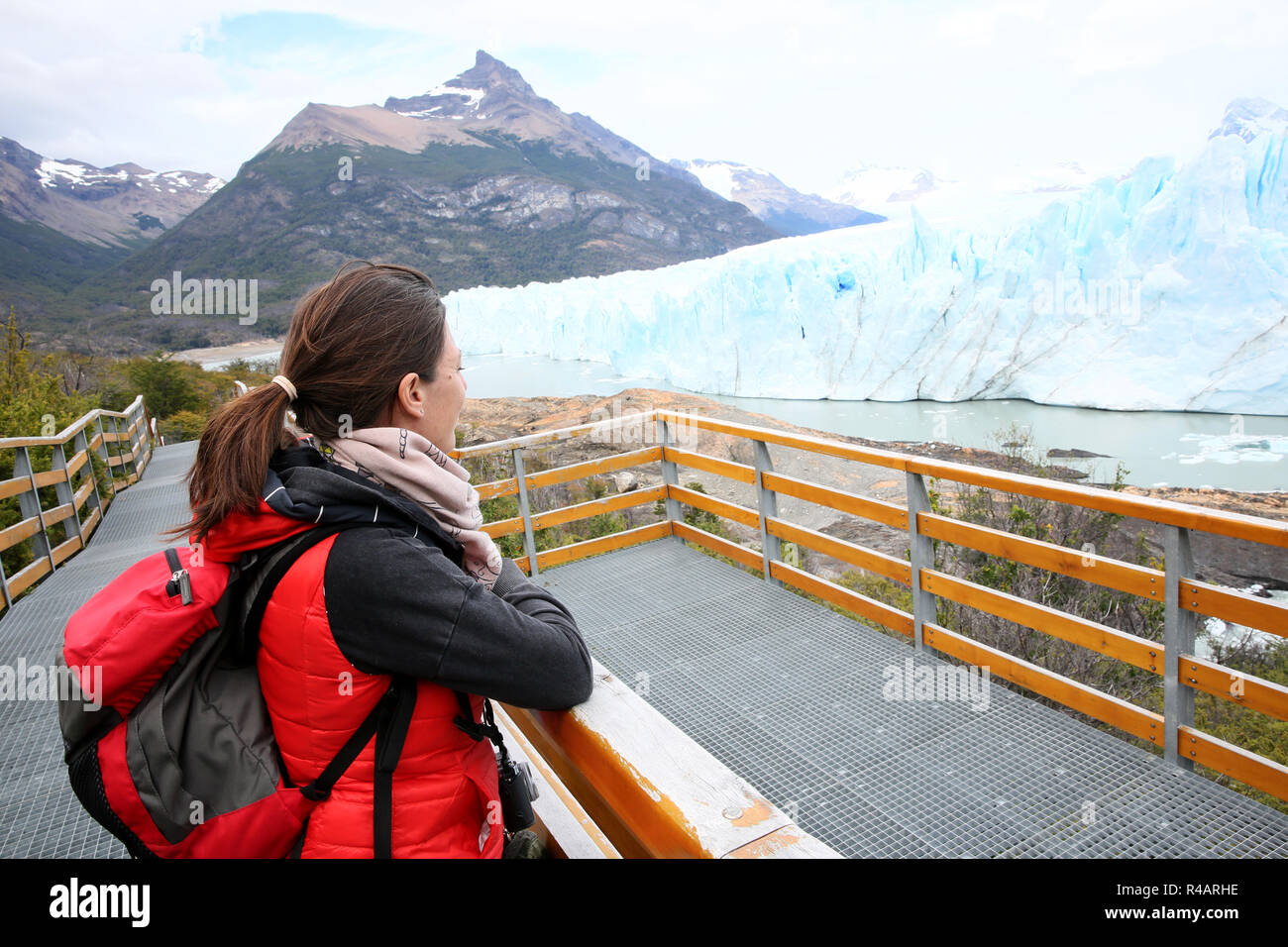Tourist standing on footbridge in front of Perito Moreno Glacier Stock ...