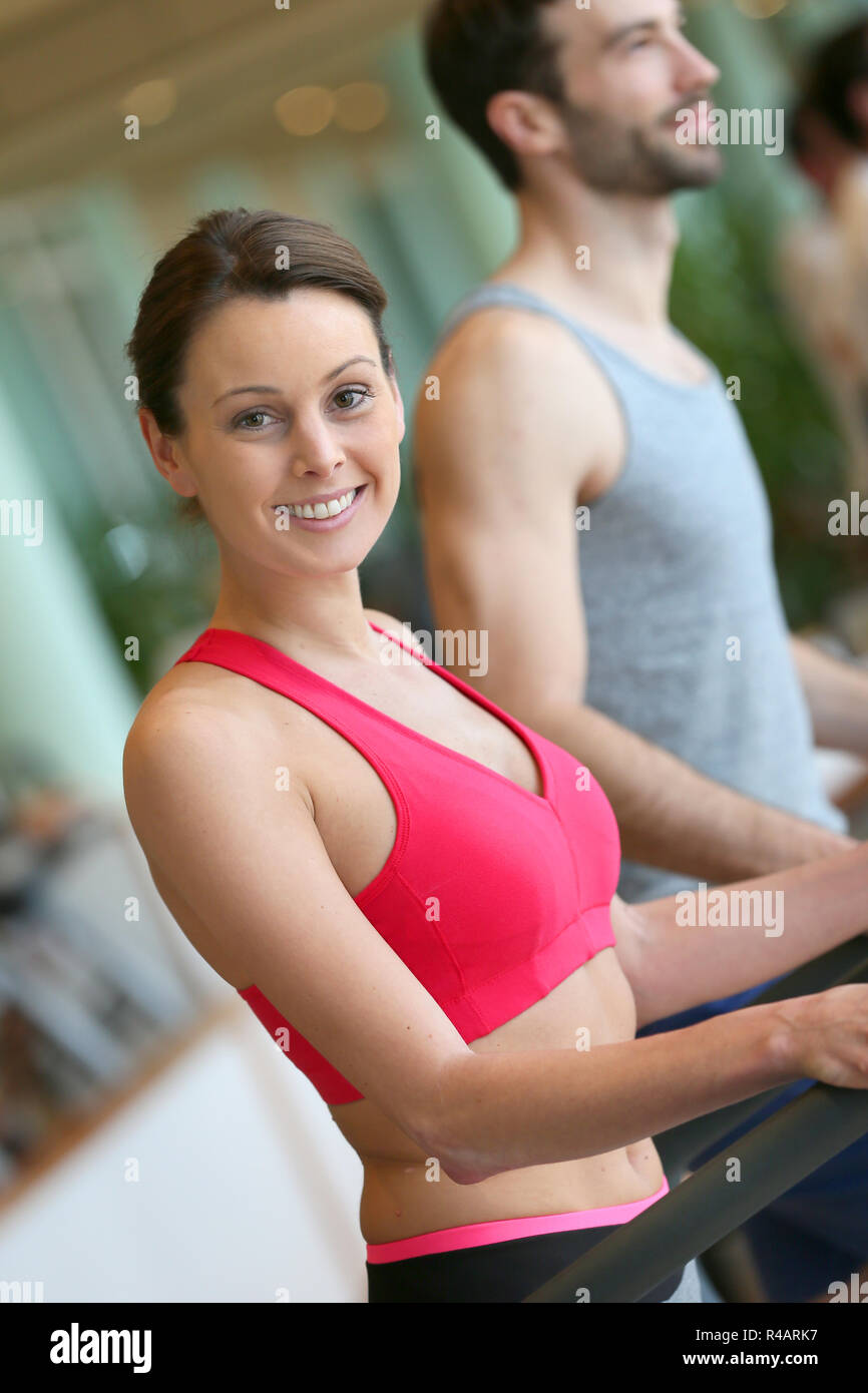 Couple doing cardio training program in fitness center Stock Photo - Alamy